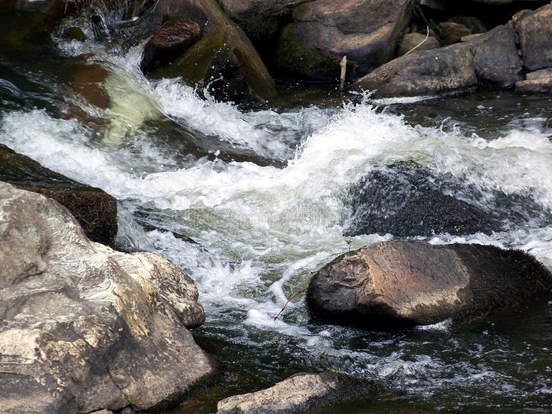 Water rushing over rocks stock image. Image of splashing - 2844675
