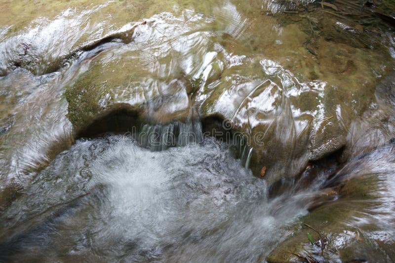 Water Rushing Over Stone stock image. Image of environment - 81836321