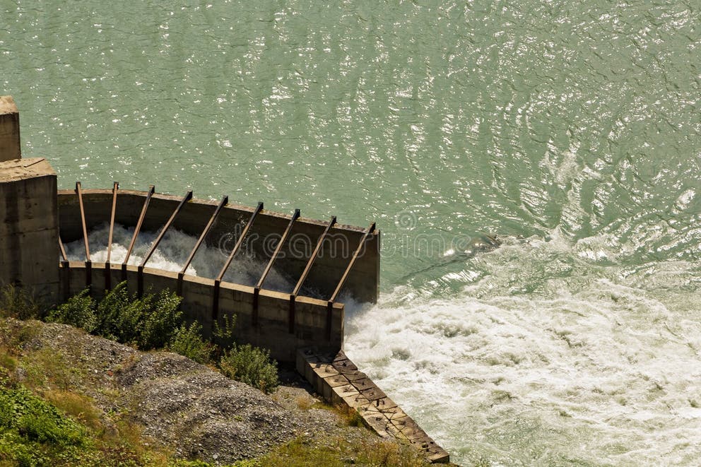 Water Rushing through Spillway into River from Dam Stock Photo - Image ...