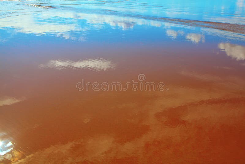 Water on sandy beach stock photo. Image of cloud, beautiful - 159566254