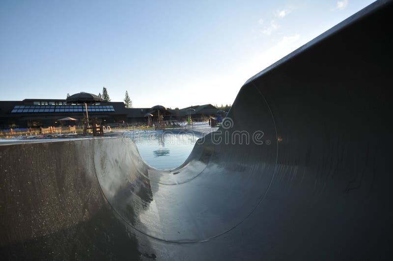 Water Slide into a Pool from within the Tube Stock Photo - Image of ...