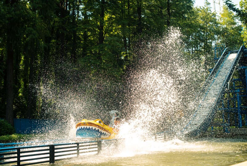Water Slide with a Sunlit Splash Underneath Stock Photo - Image of ...