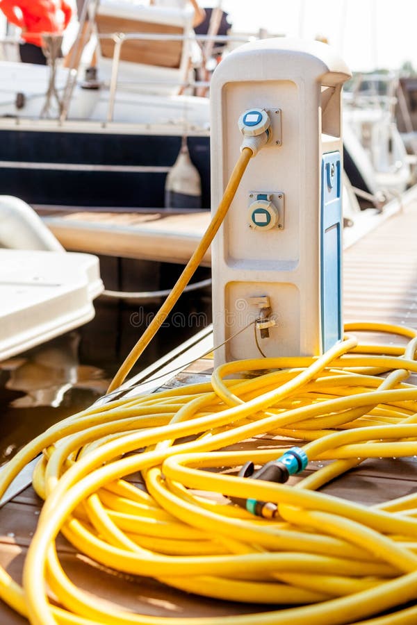 Water source on dock stock image. Image of coils, coil - 26316907