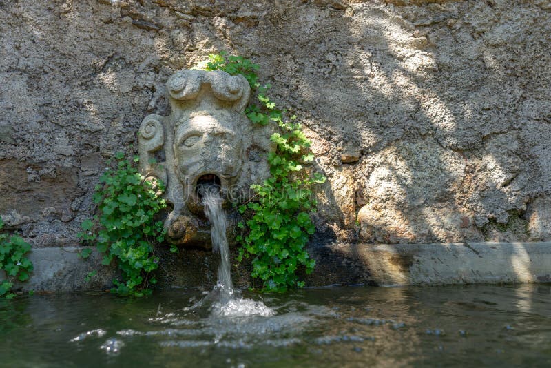 Water Source with a Human Figure Head Expelling Water Looking Like he ...