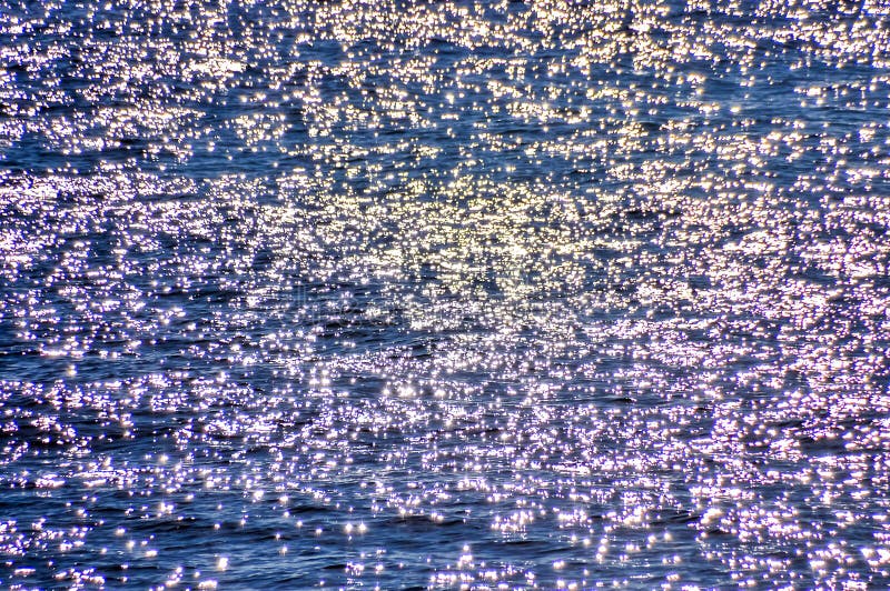 The Water is Sparkling with Light Reflecting Off the Surface Stock ...