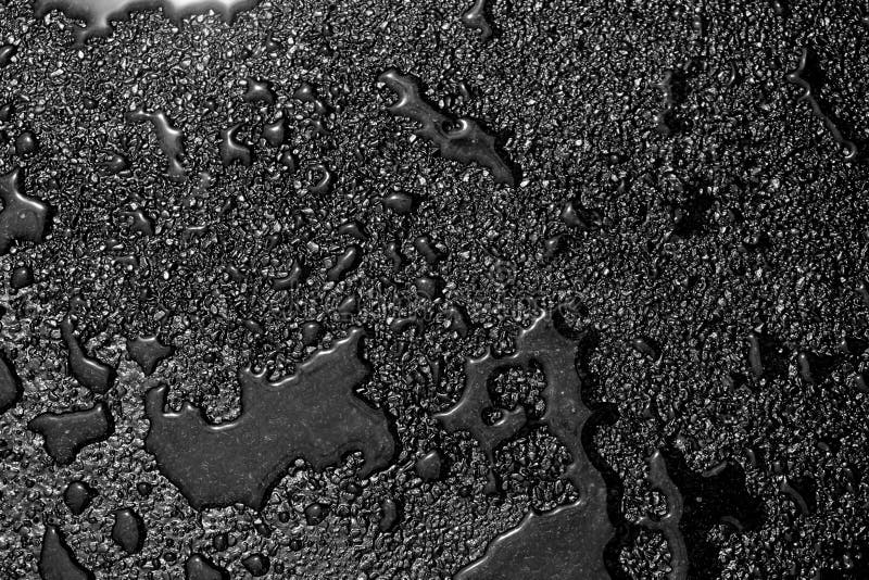 Water is Spilled on a Black Textured Surface Stock Image - Image of ...