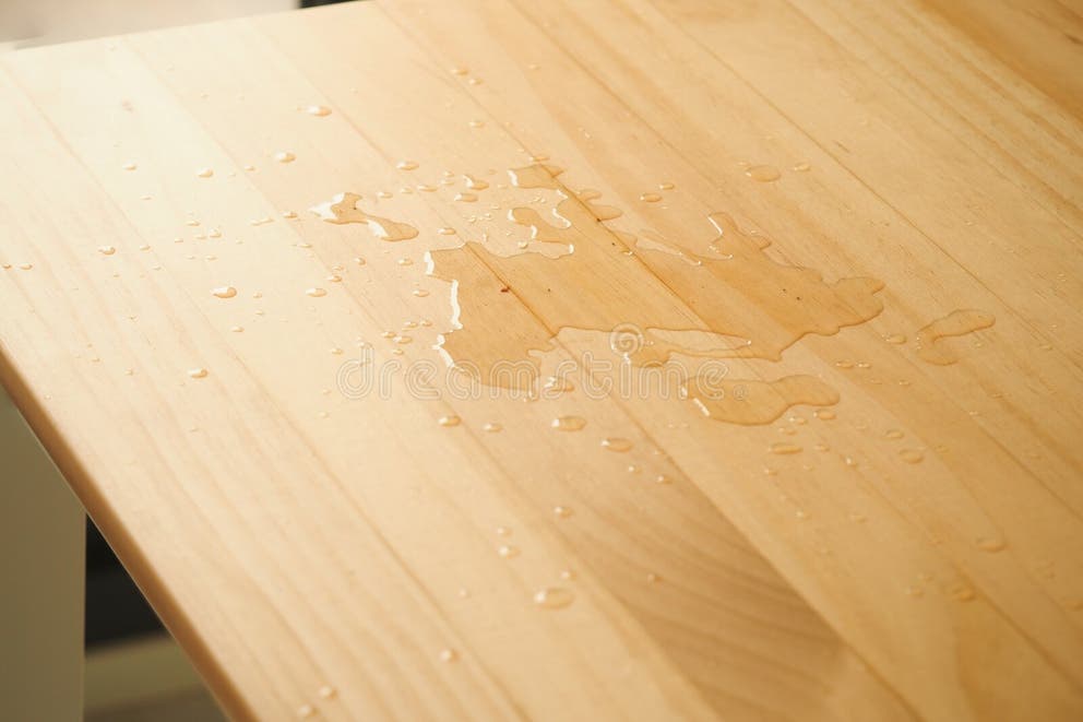 Water Spilled on a Wooden Table Surface in Natural Light Stock Image ...