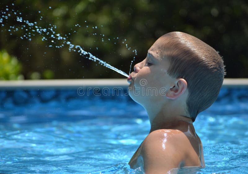 Boy Spitting Water stock photo. Image of spray, youth - 9011818