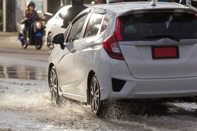 Water Splash with Car on Flooded Road after Rains Stock Photo - Image ...