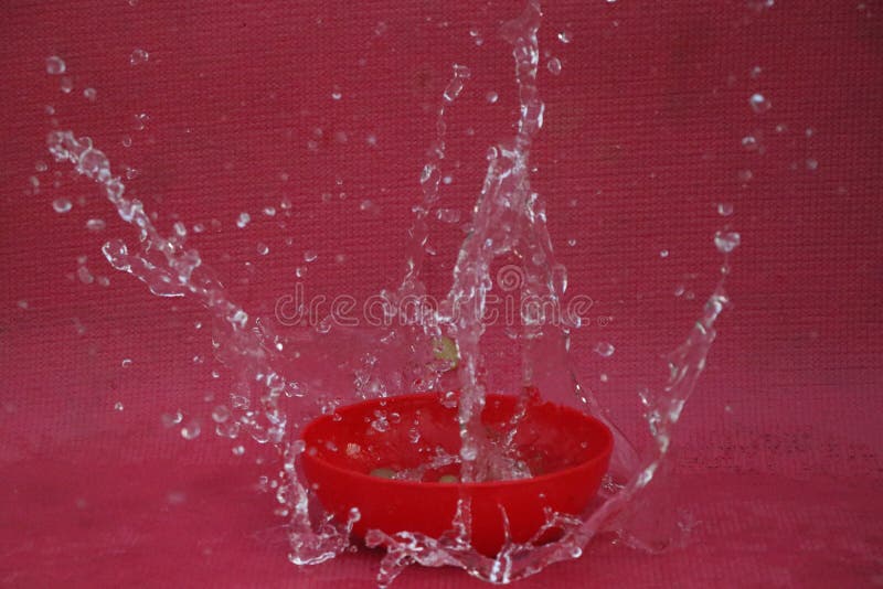 Water Splash and Drops in Red Bowl Stock Photo - Image of splash ...