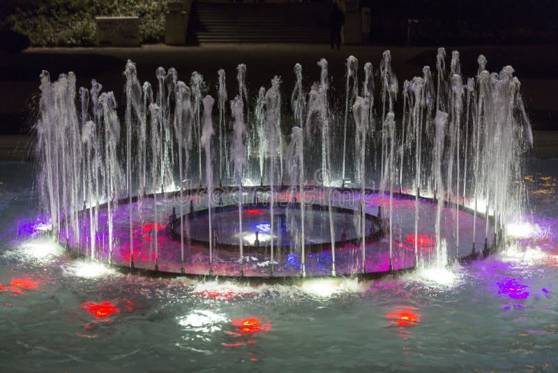 Water splash in the night stock photo. Image of fountain - 202499496