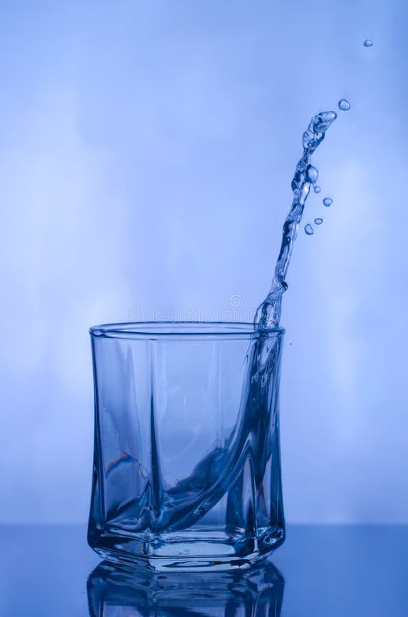 Water splash in a glass stock photo. Image of drink, flowing - 85239648