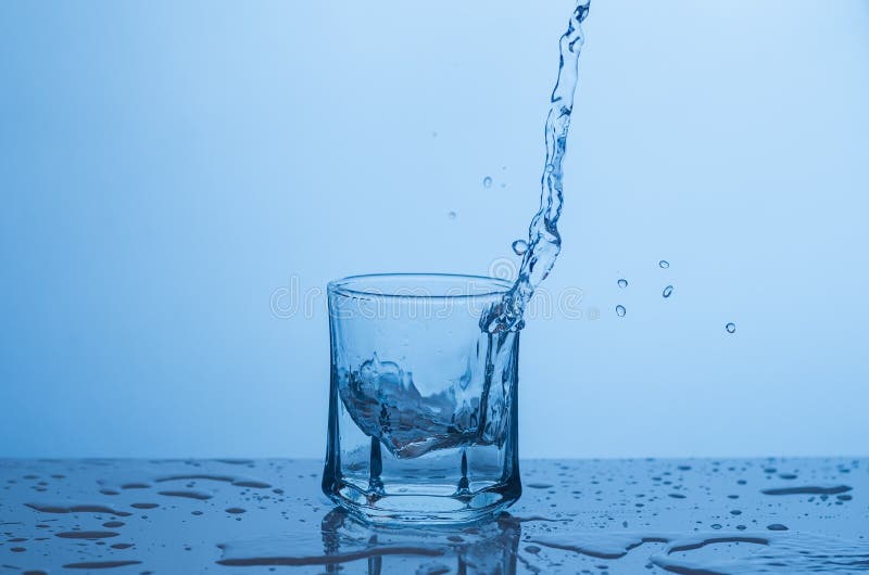 Water splash in a glass stock image. Image of crystal - 85652815