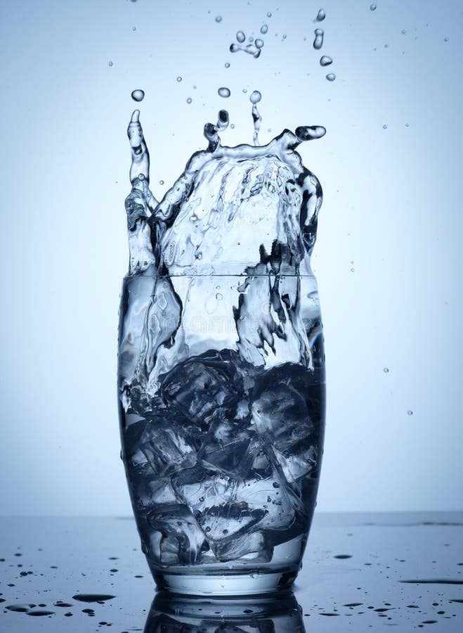 Water Splash in Glass with Ice Cubes Stock Image - Image of flowing ...