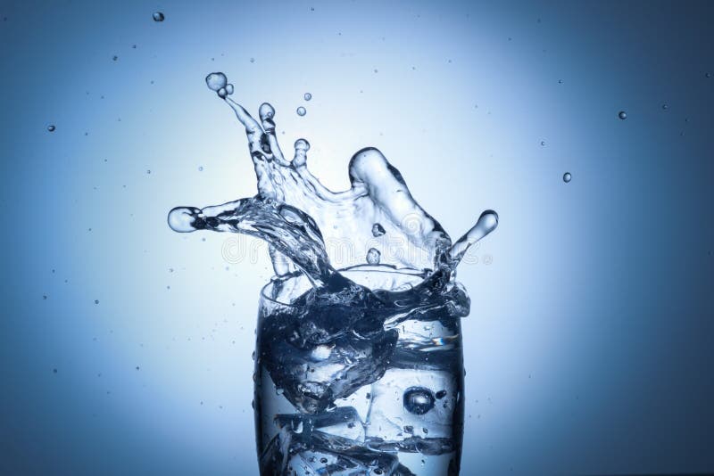 Water Splash in Glass with Ice Cubes Stock Image - Image of flow, ripple: 80495733