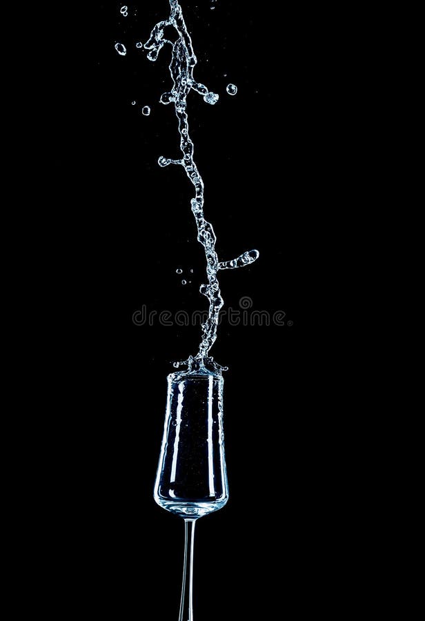 Water Splash with Inverted Glass and Black Background Stock Photo ...