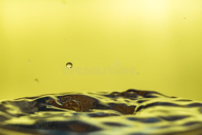 Water Splash Isolated on Yellow Background Stock Image - Image of ...