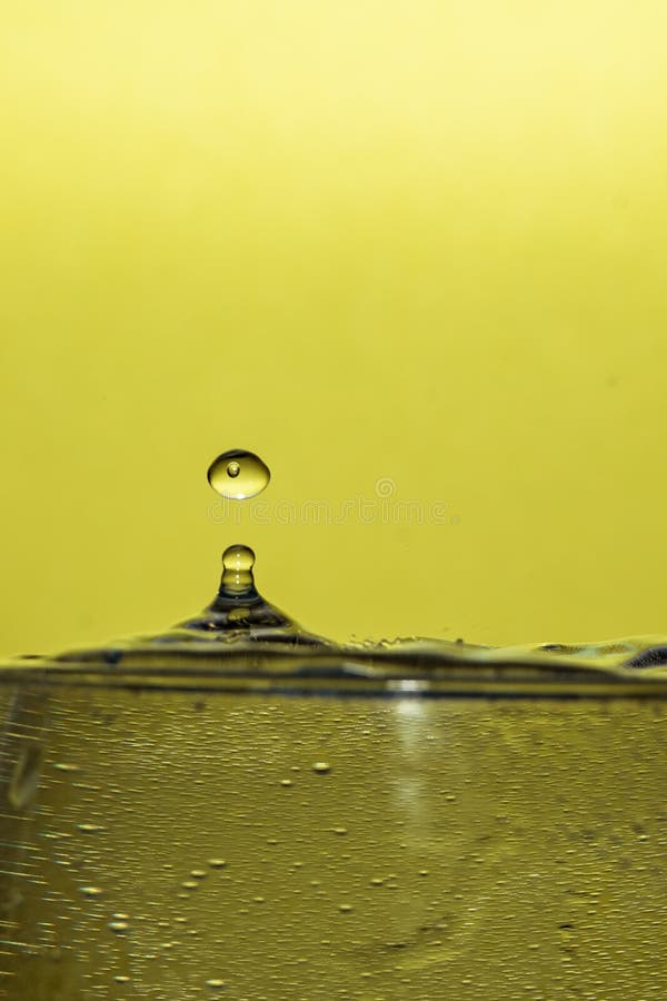 Water Splash Isolated on Yellow Background Stock Photo - Image of ...