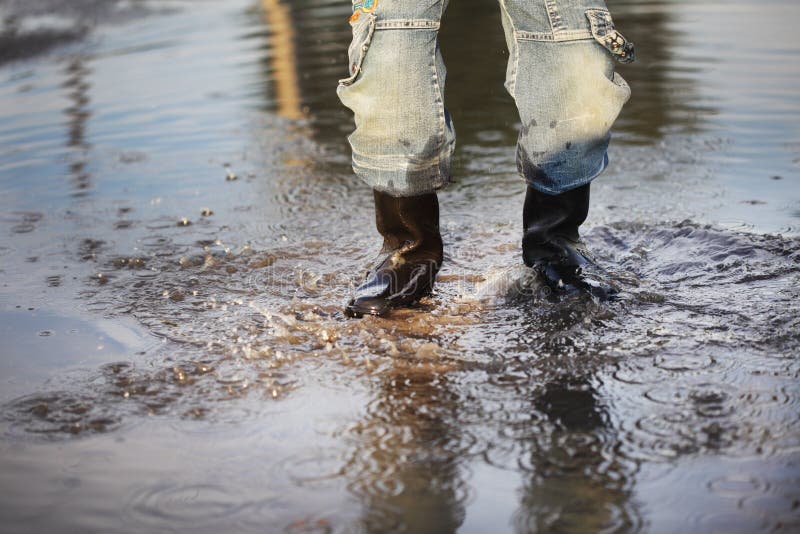 Water splash in puddle stock photo. Image of blue, child - 20530852
