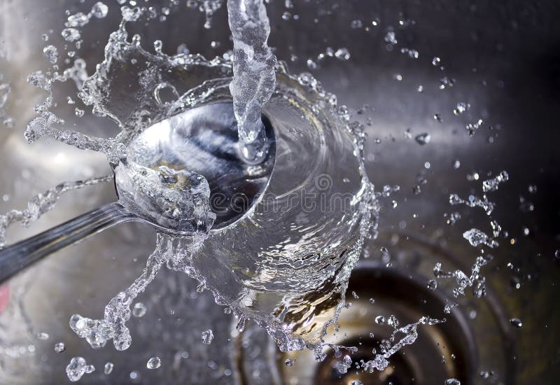 Water Splash on Spoon stock photo. Image of droplet, tunnel - 77742550
