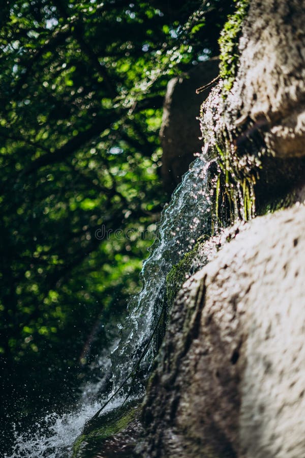 Water Splashes on a Large Stone. Splashes of a Small Waterfall in the ...