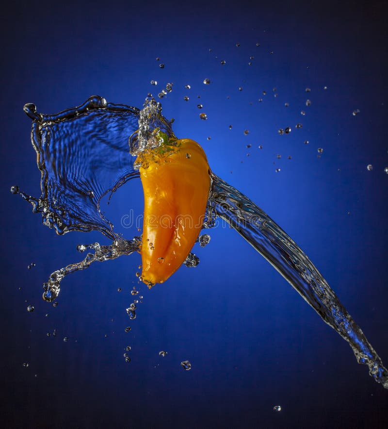 Water Splashes on Mini Bell Stock Photo - Image of drink, orange: 168246020