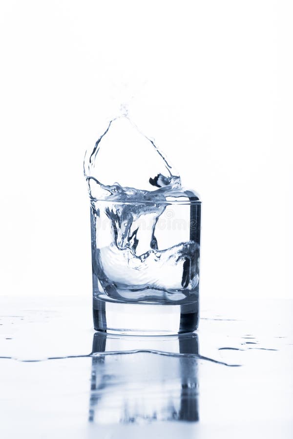 Water splashing from glass stock photo. Image of glass - 70231946