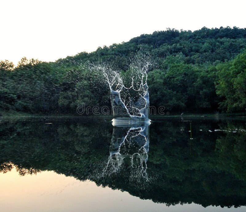 Water Splash on a Pond beside a Hill Stock Image - Image of drop ...