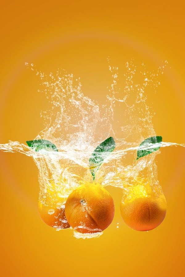Water Splashing on Orange and Tea Leaves Refreshing Summer Concept ...