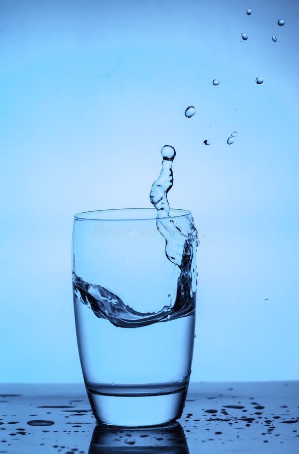 Water Splashing Out of a Glass Stock Image - Image of flowing, drink ...