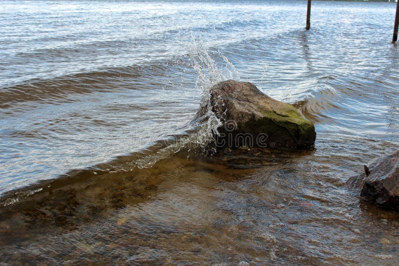 Water Splashing on a rock stock image. Image of brown - 98456583