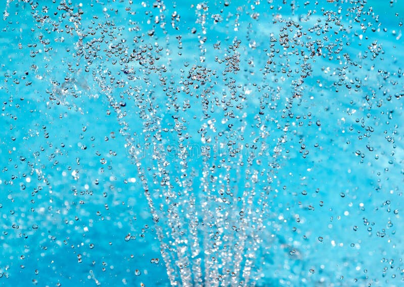 Water Spray Fountain on Turquoise Background Stock Photo - Image of ...