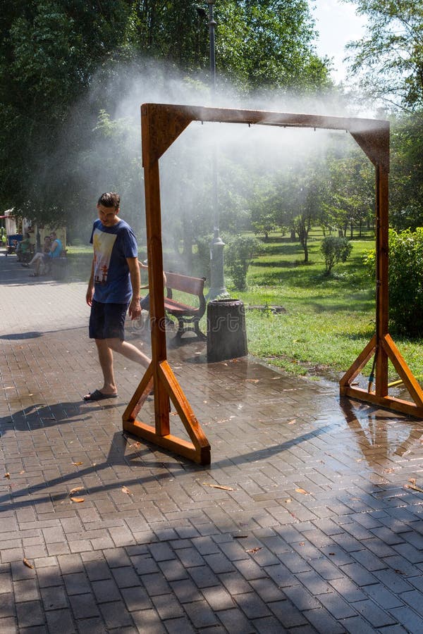 Water spray in the park. editorial photo. Image of cycling - 97586786