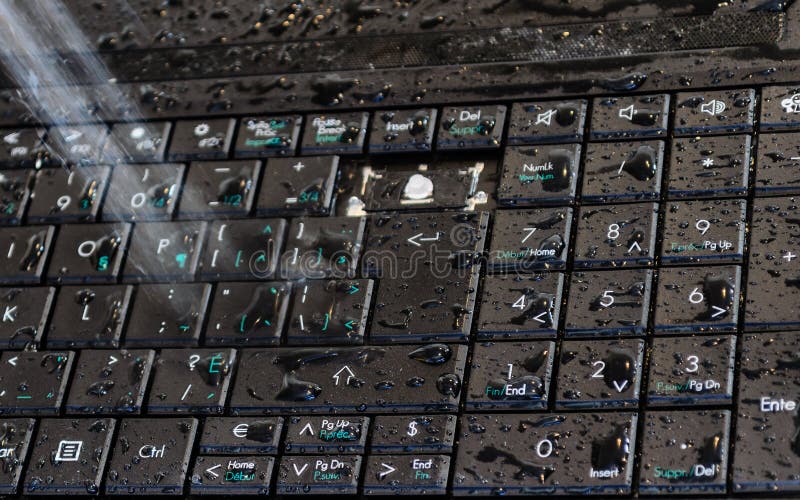Water Spray Pouring Onto Bilingual European Computer Keyboard Laptop ...