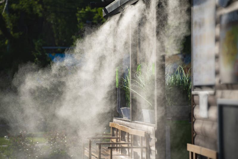 Water Spray System for Cooling in a Public Cafe at the Boiling Hot ...