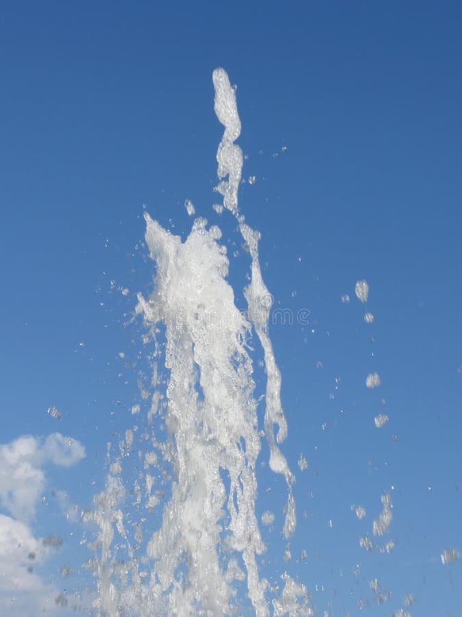 Water Spraying from a Fountain Against the Blue Sky Stock Photo - Image ...