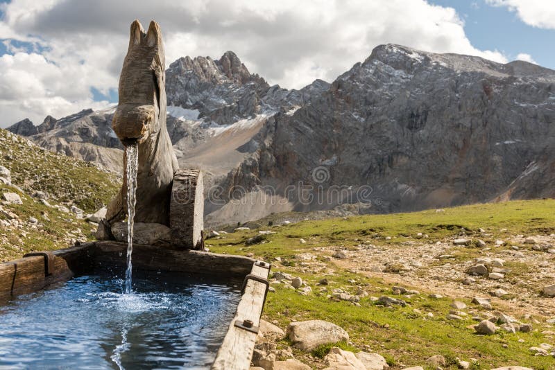 Water Spring on Alps Mountains Background. Stock Image - Image of arms ...