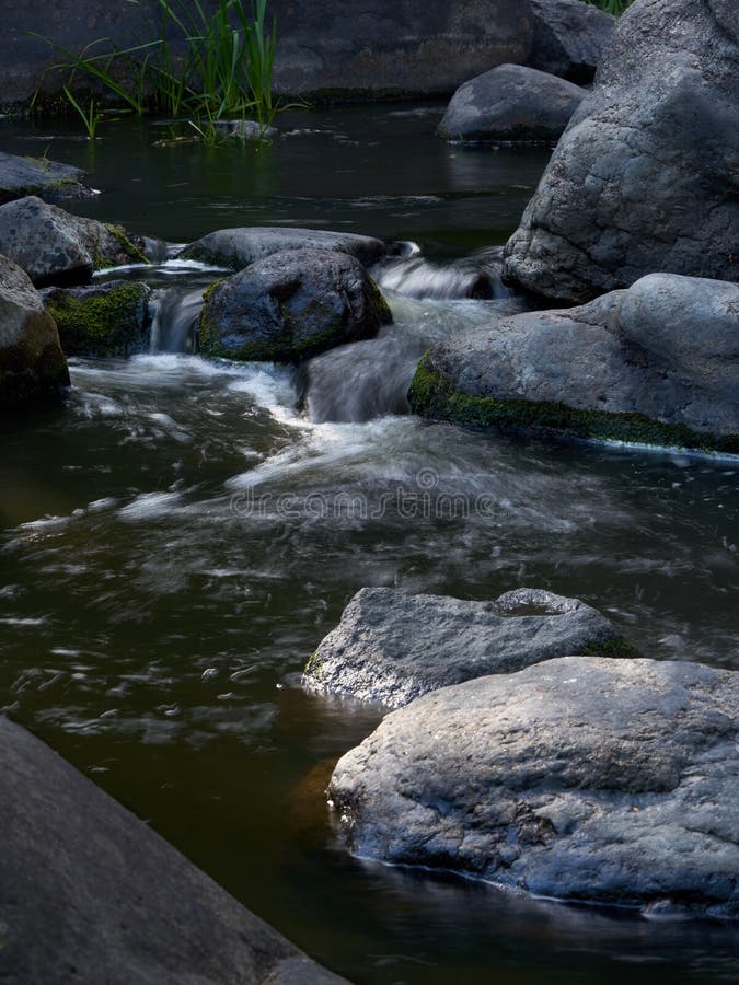 Water Spring Water Flowing Over Rocky Creek Bed. Stock Photo - Image of ...