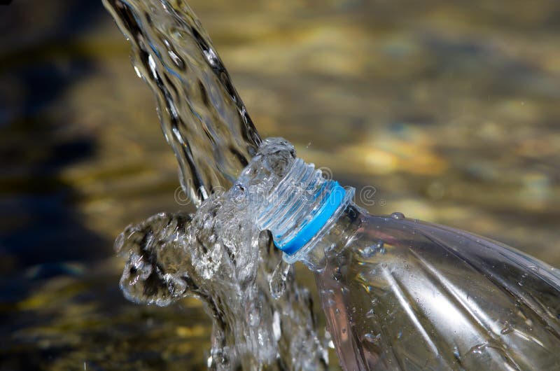 Source of Spring Water Bottle Filling Holding Hand Stock Image - Image ...