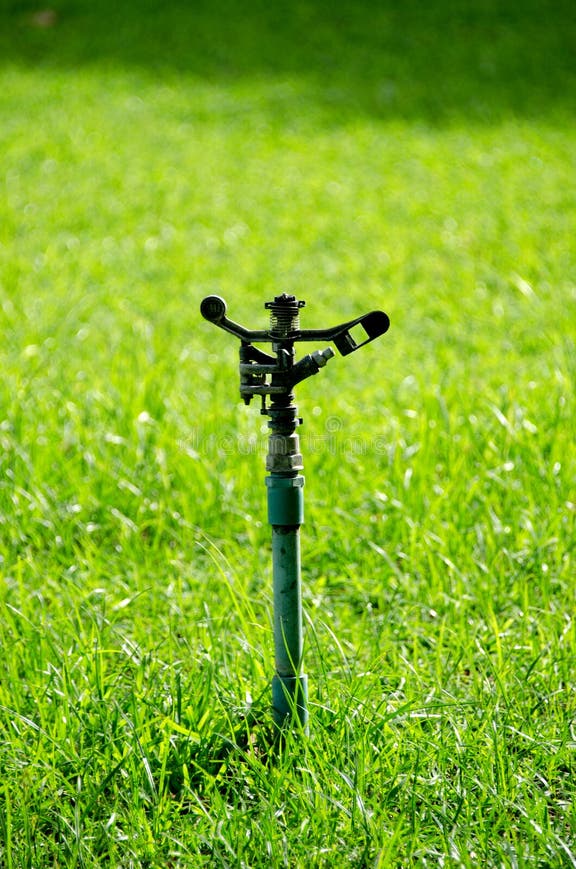 Water sprinkle stock image. Image of equipment, greenery - 19803103