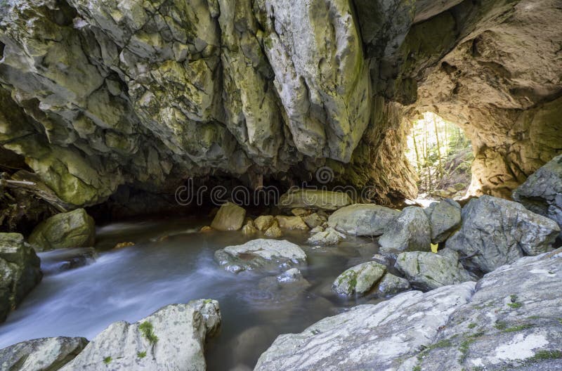 Water through stone tunnel stock photo. Image of mineral - 53582466