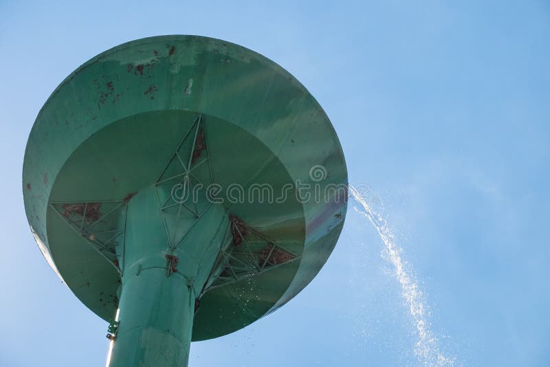 Water Storage Tank Over Flowing in Green Large Stock Image - Image of ...