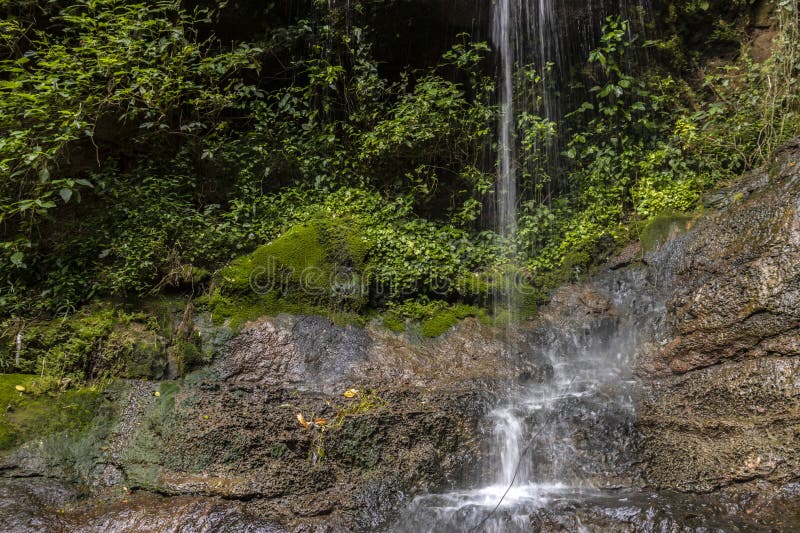Water from a Stream Falls Over Rocks To Form a Small Waterfall in the ...
