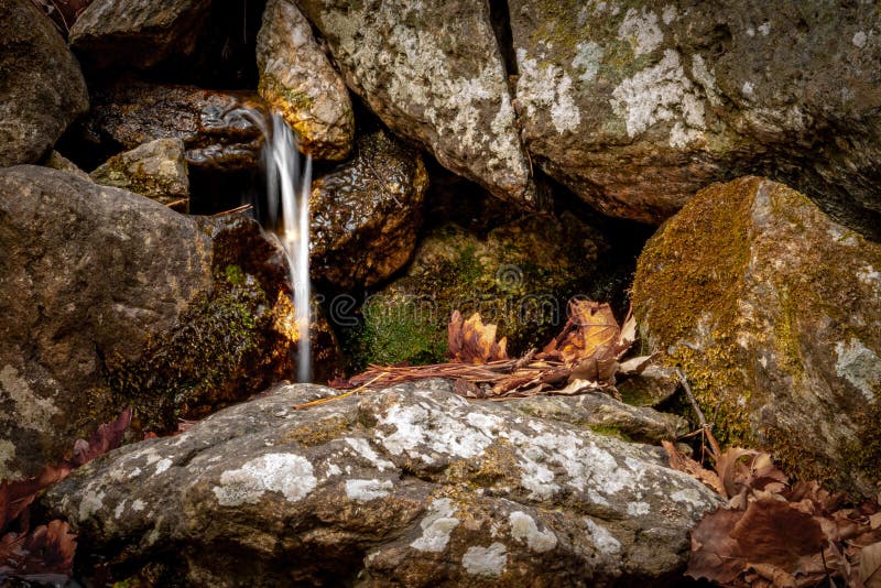 Water Stream Flowing through the Big Rock Wall in Autumn Stock Image ...