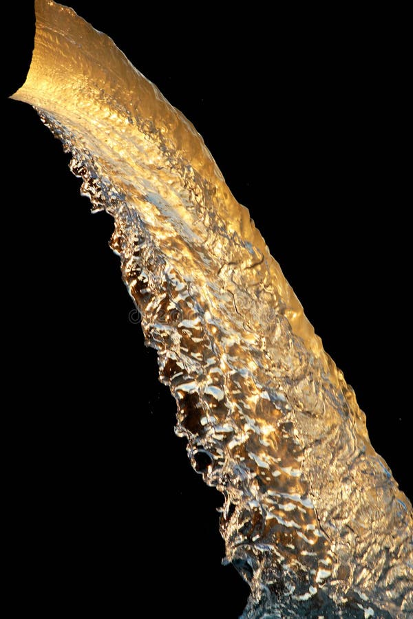 Water Stream Flowing Out of Pipe Against Black Background Stock Photo ...