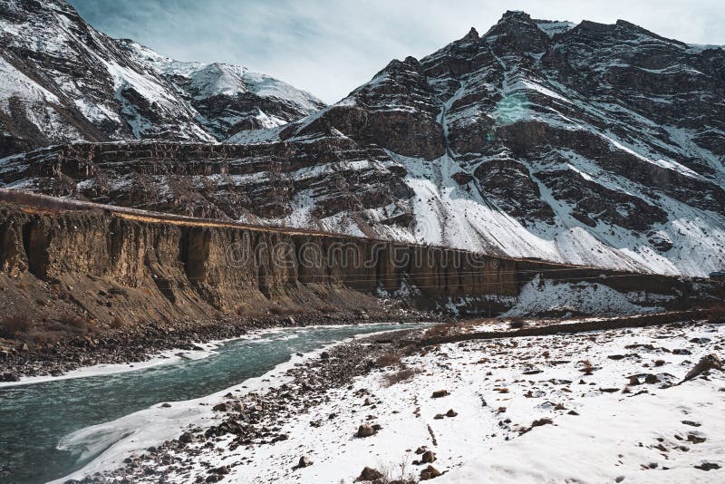 Water Stream with the Mountains Covered in Snow in Spiti Valley Stock ...