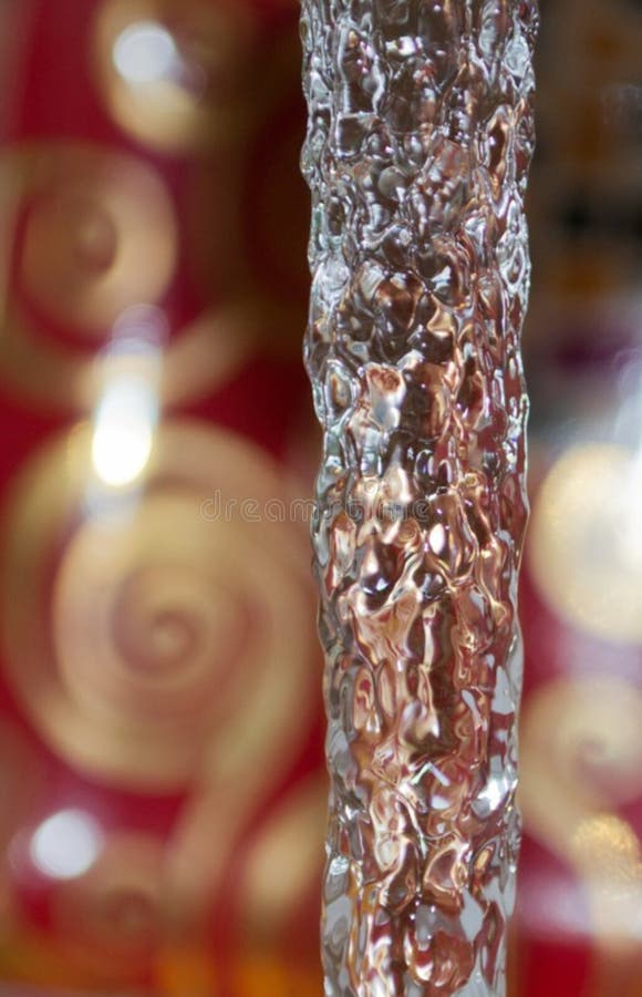 Water-stream-by-red-and-gold-tile Stock Image - Image of : 87859431