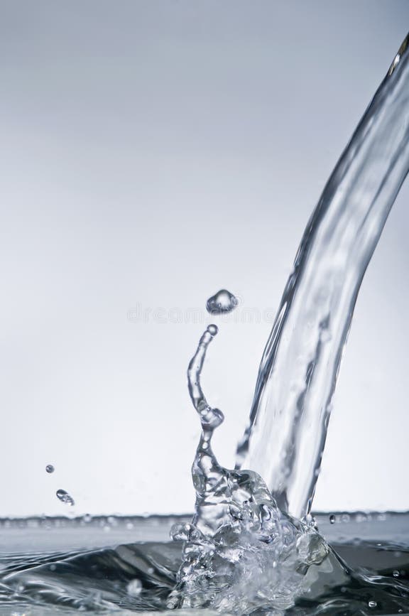 Water Stream with Splash on Blue Stock Photo - Image of abstract ...