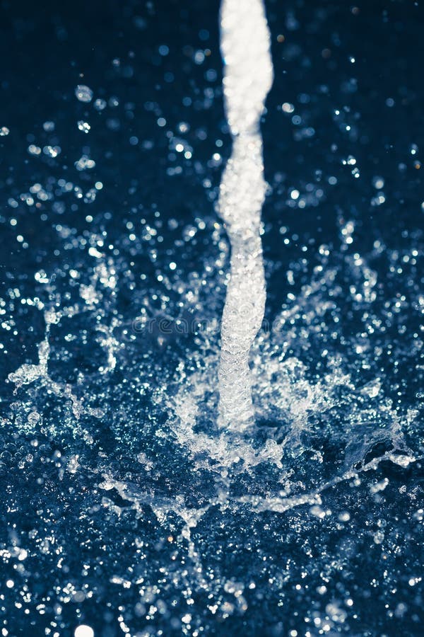 Water Stream with Splash Drops, Blue Background Stock Image - Image of ...