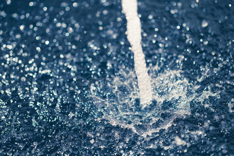 Water Stream with Splash Drops, Blue Background Stock Image - Image of ...